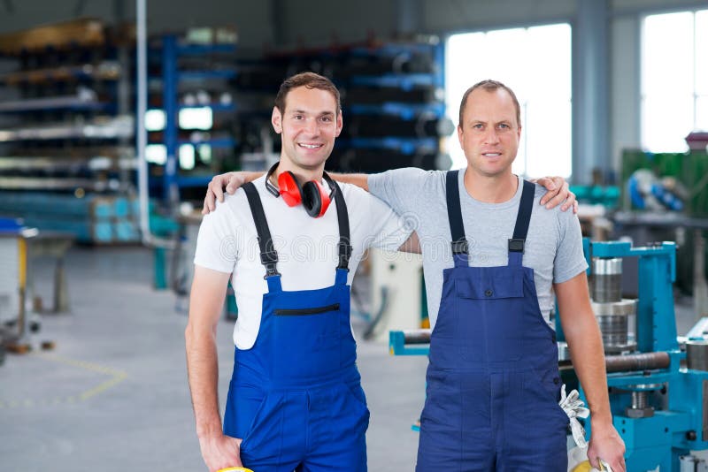 Two worker in factory stock image. Image of steel, production - 71797437