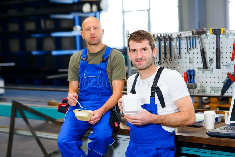 Two Worker in Factory Have a Break Stock Photo - Image of industry ...