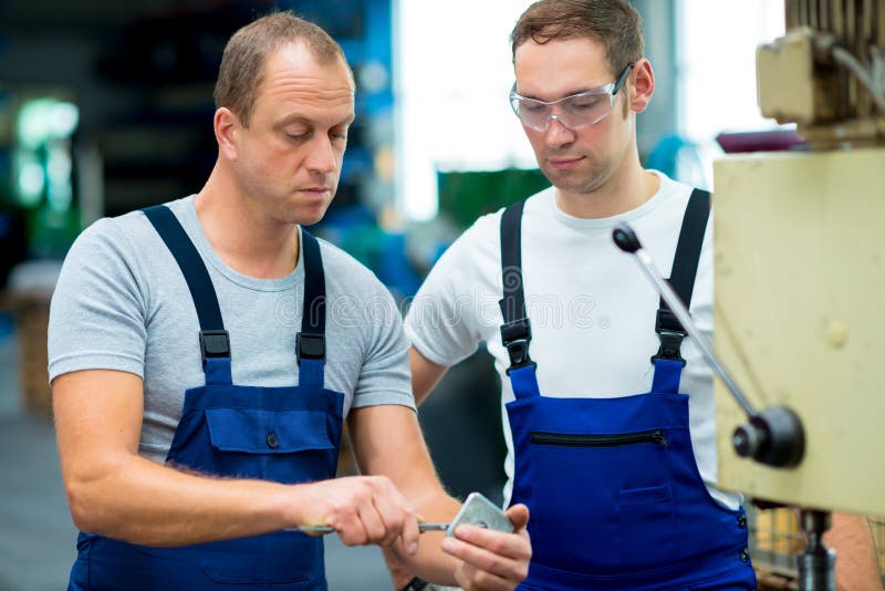 Two Worker in Factory on the Machine Stock Image - Image of helmet ...