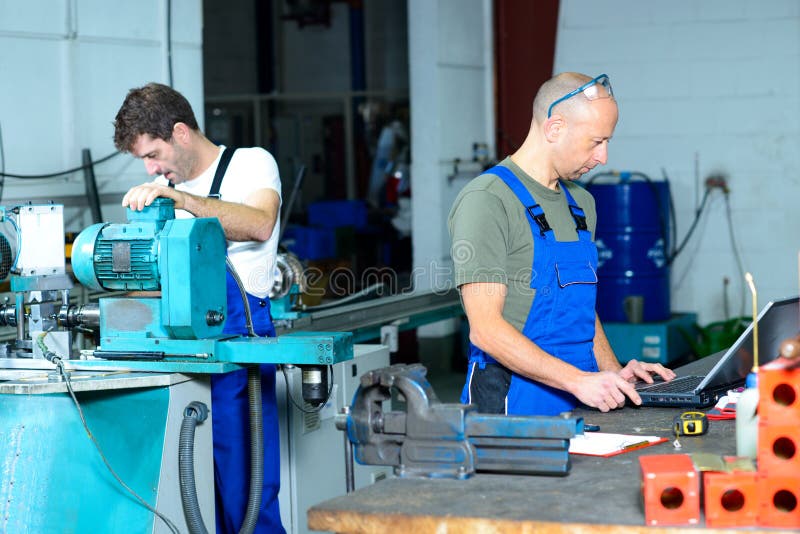 Two worker in factory stock image. Image of improvement - 107652423