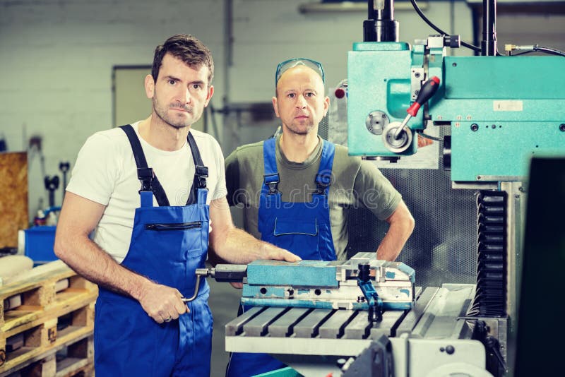 Two worker in factory stock photo. Image of foreman - 124588906