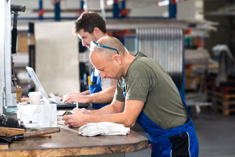 Two worker in factory stock image. Image of production - 82660357