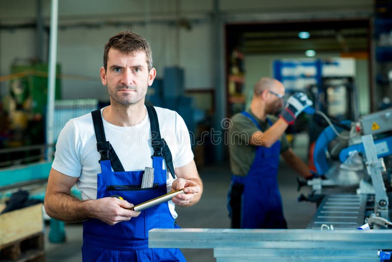 Two Worker on Work Bench in Factory Stock Photo - Image of plant ...