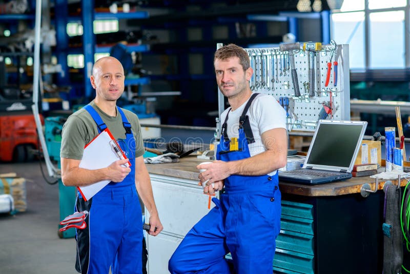Two Worker on Work Bench in Factory Stock Photo - Image of plant ...