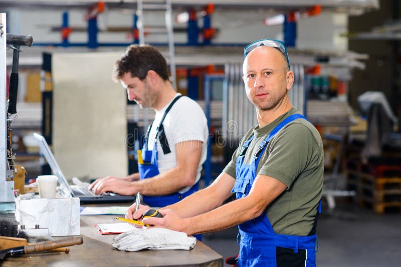 Two worker in factory stock image. Image of active, business - 84527531