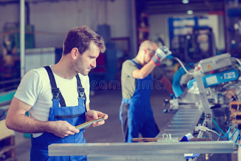 Two worker in factory stock image. Image of metal, middle - 87289969