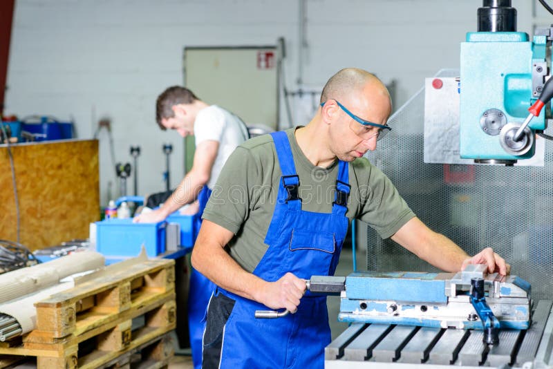 Two worker in factory stock image. Image of equipment - 124588739