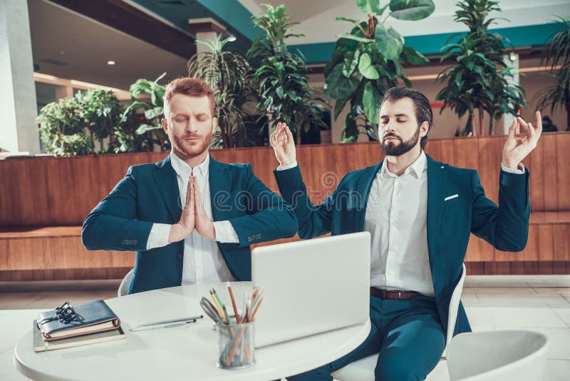 Worker Man Meditating at Desk in Office. Stock Image - Image of ...