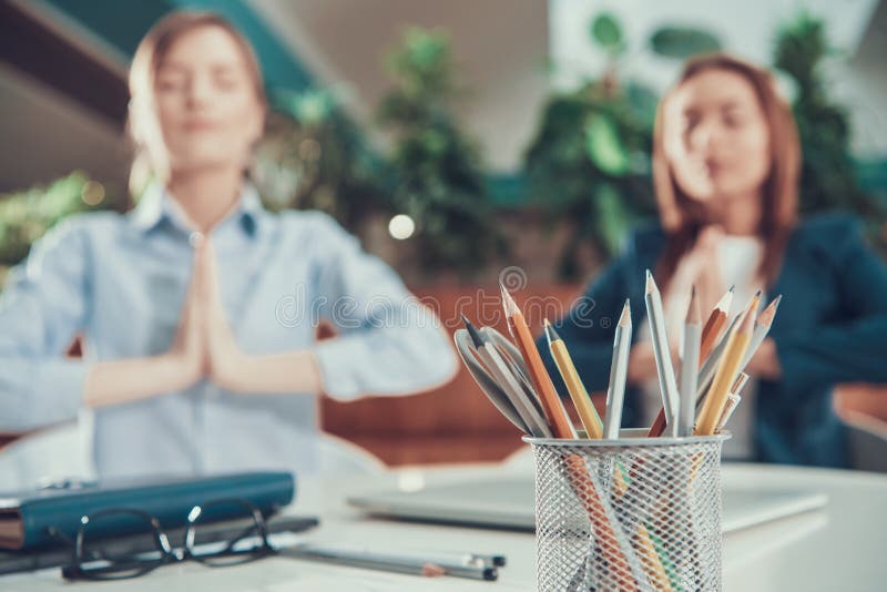 Two Worker Women Meditating in Office. Stock Photo - Image of health ...