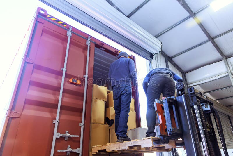 Workers Unloading Boxes from Shipping Container at Warehouse in Broad ...