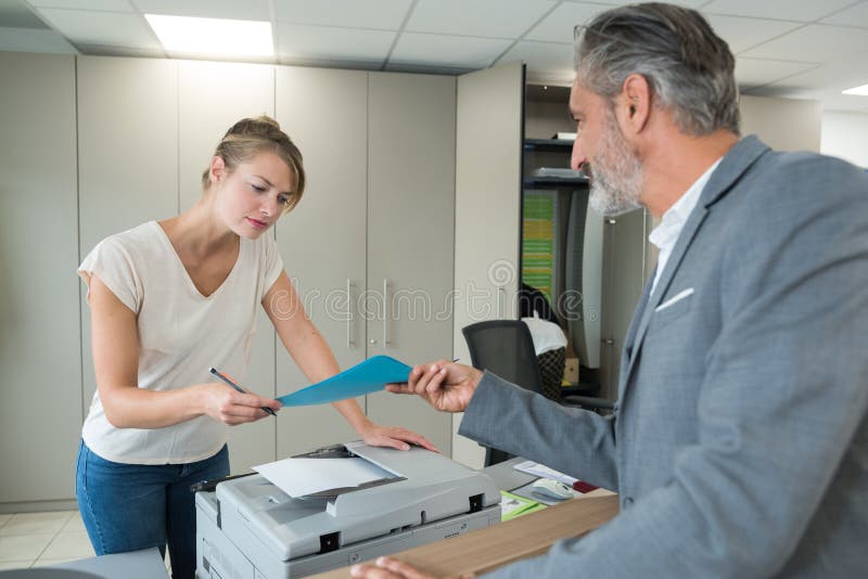 Two Workers Checking Paper Work Stock Image - Image of business, folder ...
