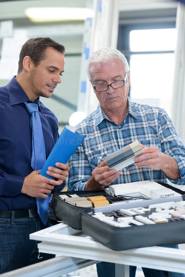 Two Workers Checking Something from Toolbox Stock Image - Image of ...