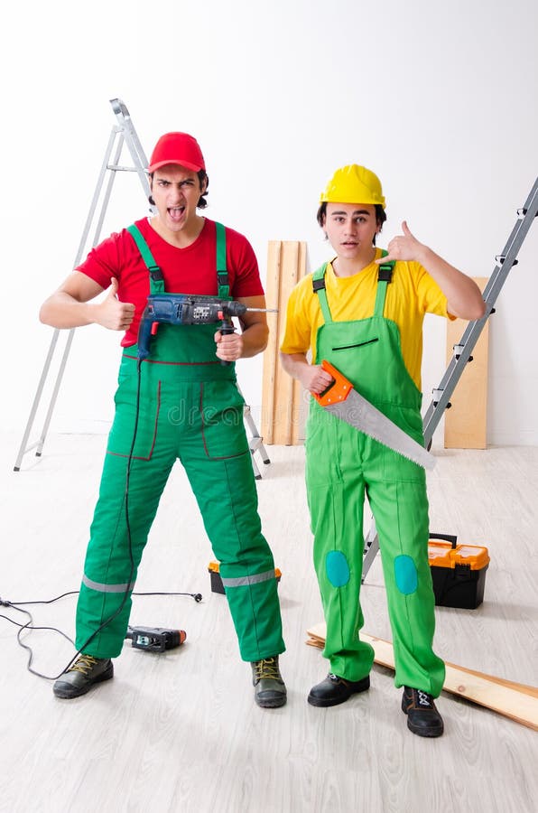 The Two Workers Contractors Working Indoors Stock Photo - Image of ...