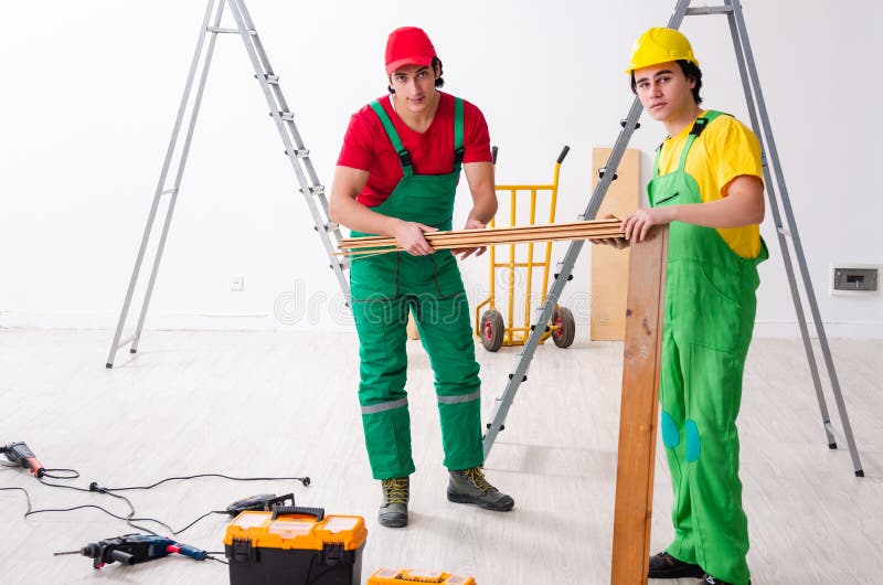 The Two Workers Contractors Working Indoors Stock Image - Image of ...