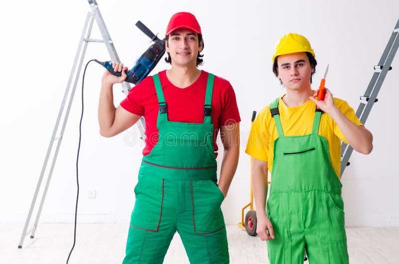 The Two Workers Contractors Working Indoors Stock Photo - Image of ...