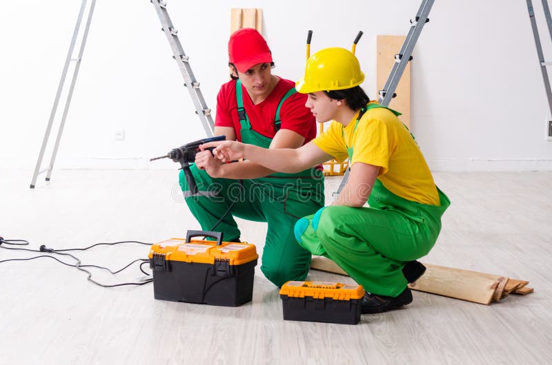 Two Workers Contractors Working Indoors Stock Photo - Image of flooring ...