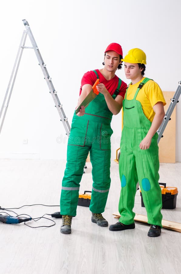 Two Workers Contractors Working Indoors Stock Photo - Image of ...