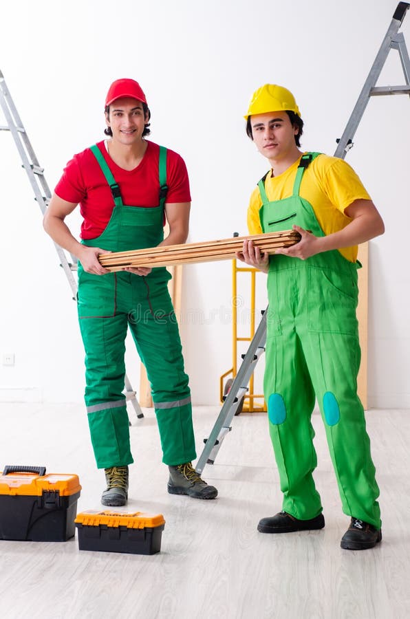 Two Workers Contractors Working Indoors Stock Image - Image of ...