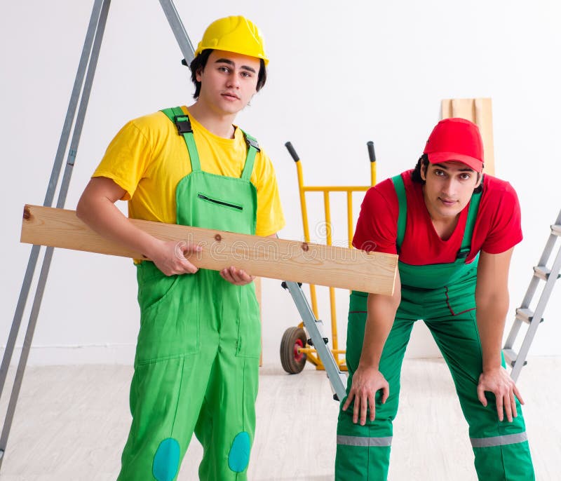 Two Workers Contractors Working Indoors Stock Photo - Image of ...