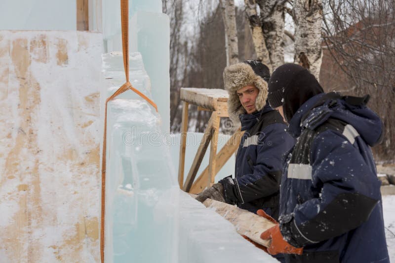 Workers are Assembling Ice Blocks on the Frame of a Wooden Slide Stock ...
