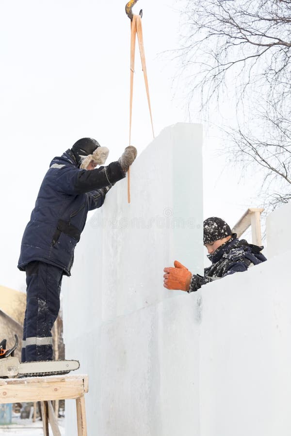 Workers are Assembling Ice Blocks on the Frame of a Wooden Slide Stock ...