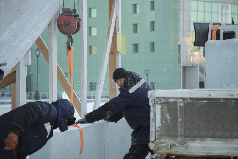 Workers are Assembling Ice Blocks on the Frame of a Wooden Slide Stock ...