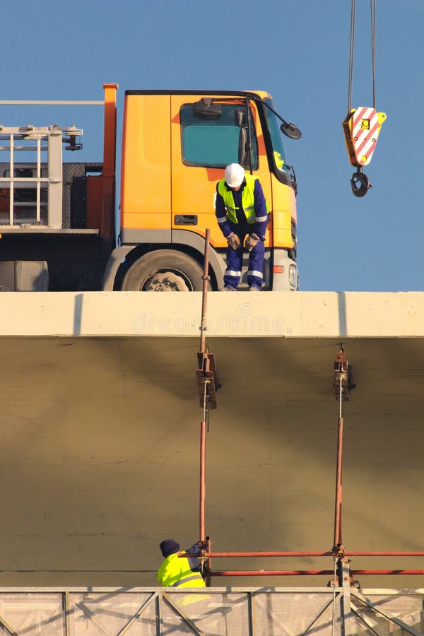 Two Workers, Crane and Track at the Reconstruction Area Stock Photo ...
