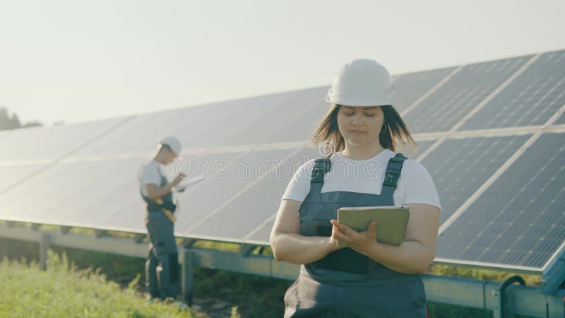 Workers at an Electricity Production Farm Collect Data from Solar ...