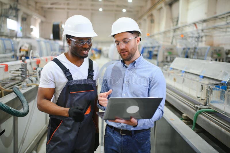 Two Workers at the Factory. Engineer and Worker Stock Photo - Image of ...