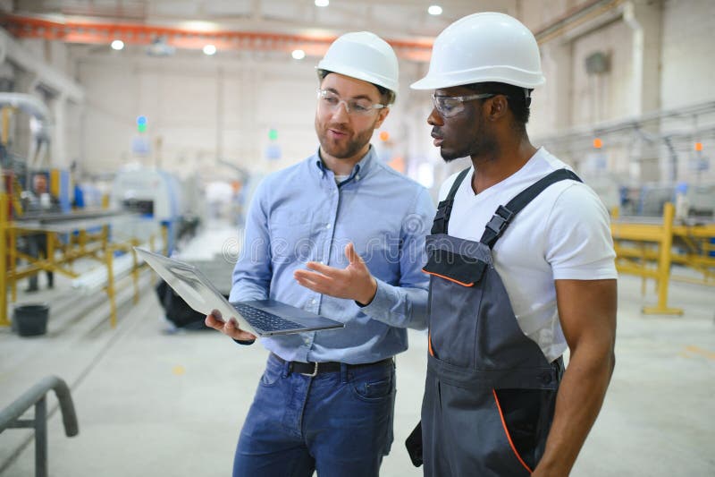 Two Workers at the Factory. Engineer and Worker Stock Image - Image of ...