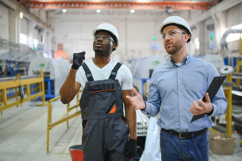 Two Workers at the Factory. Engineer and Worker Stock Image - Image of ...