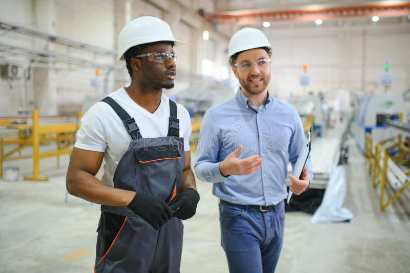 Two Workers at the Factory. Engineer and Worker Stock Photo - Image of ...
