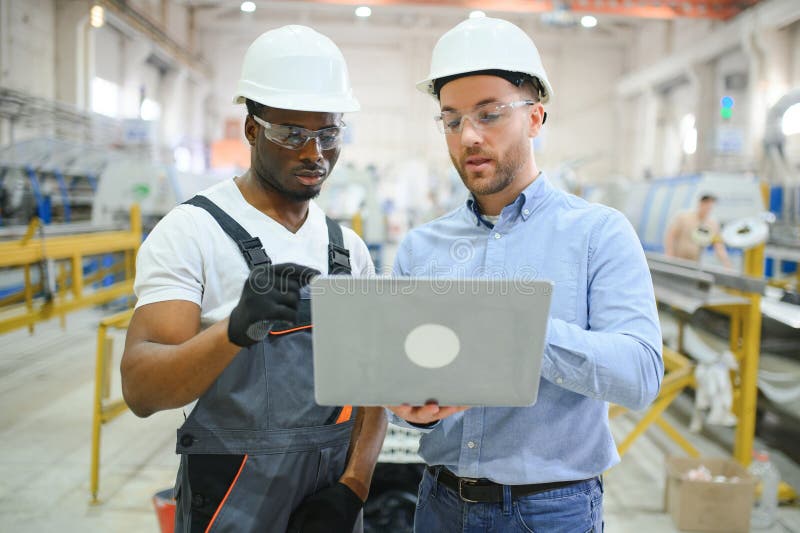 Two Workers at the Factory. Engineer and Worker Stock Photo - Image of ...