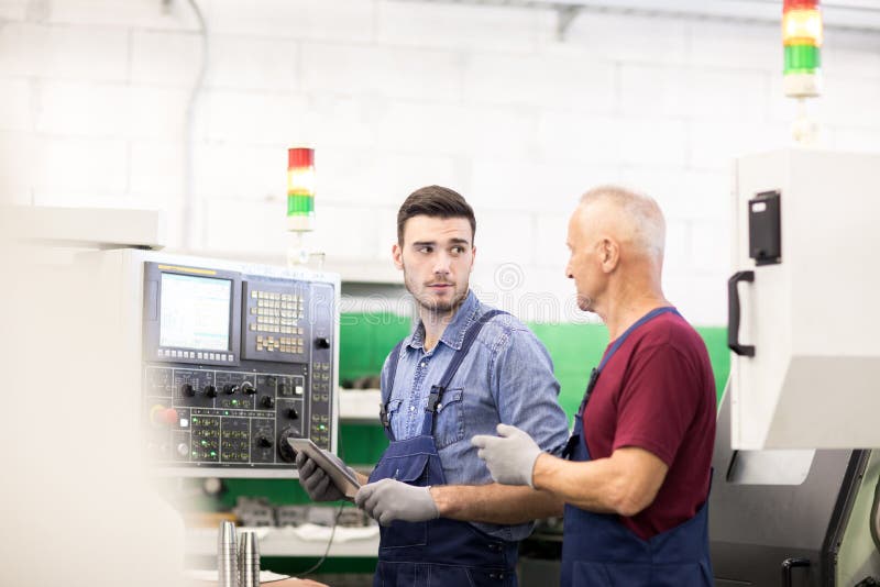 Two Workers in Factory on the Machine Stock Image - Image of equipment ...