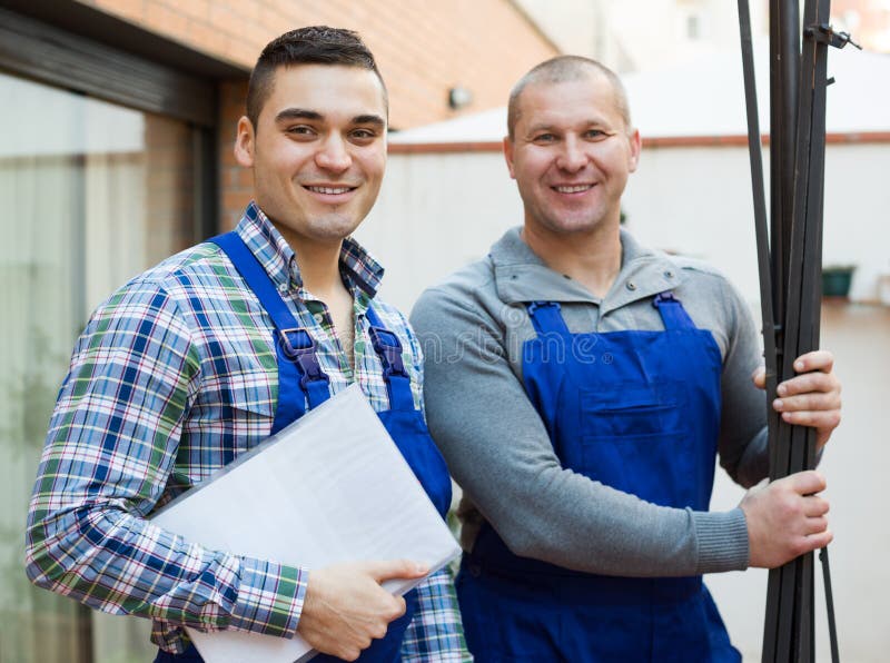 Two workers at factory stock image. Image of factory - 63737845