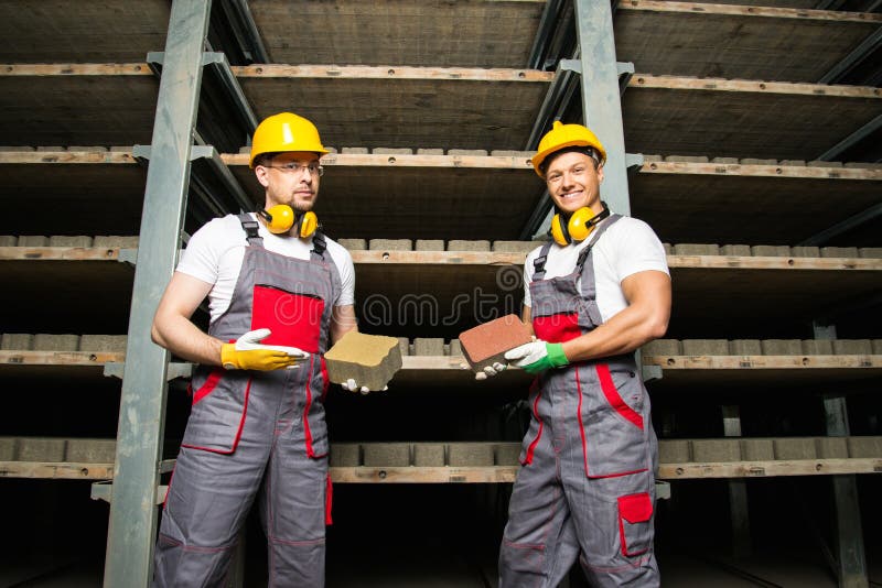 Two workers on a factory stock image. Image of assembly - 39967473
