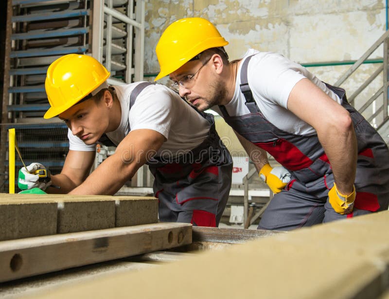Construction Workers Checking Stock Photo - Image of measuring ...