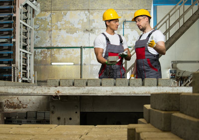 Two workers on a factory stock photo. Image of people - 39967446