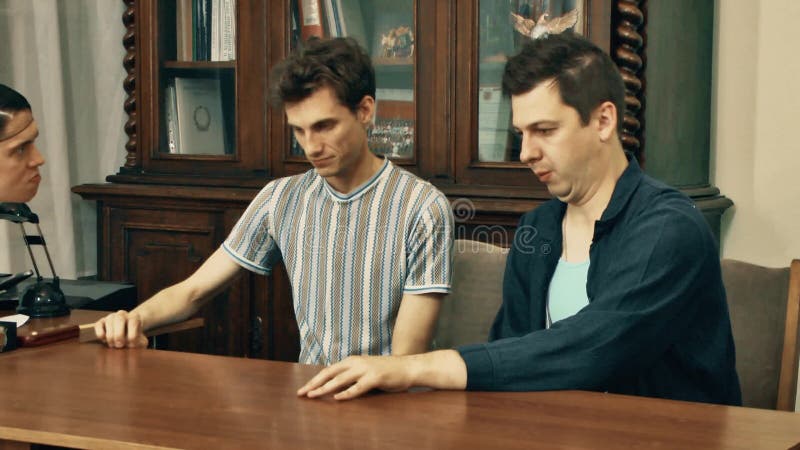 Two Workers Get Berated by Boss at Office Table with Wood Bookcase on ...