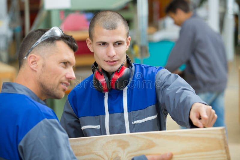 Two Workers Holding Industrial Board Stock Photo - Image of board, work ...