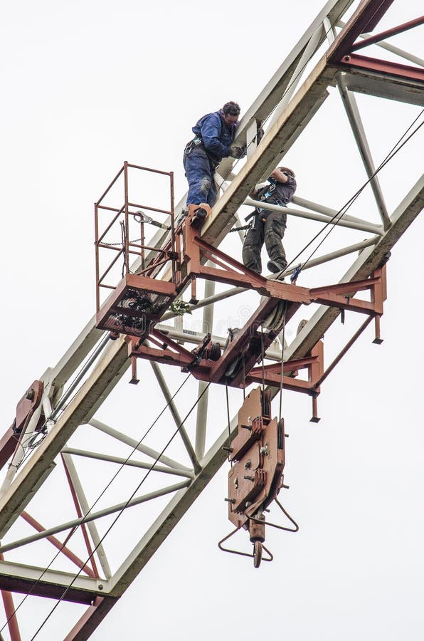 Two Workers on a Horizontal Crane Truss Editorial Stock Photo - Image ...