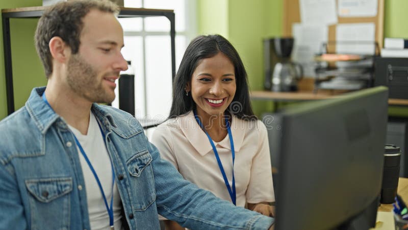 Two Workers Man and Woman Sitting on Table Using Computer Speaking at ...