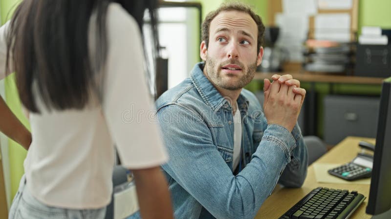 Two Workers Man and Woman Using Computer Speaking at the Office Stock ...