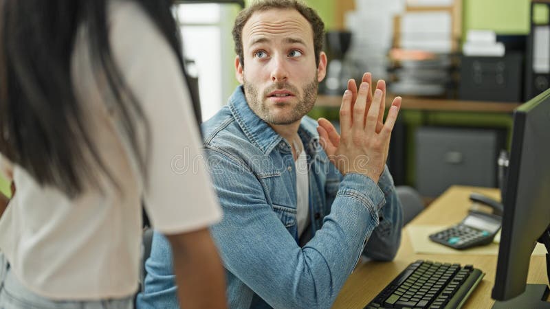 Two Workers Man and Woman Using Computer Speaking at the Office Stock ...