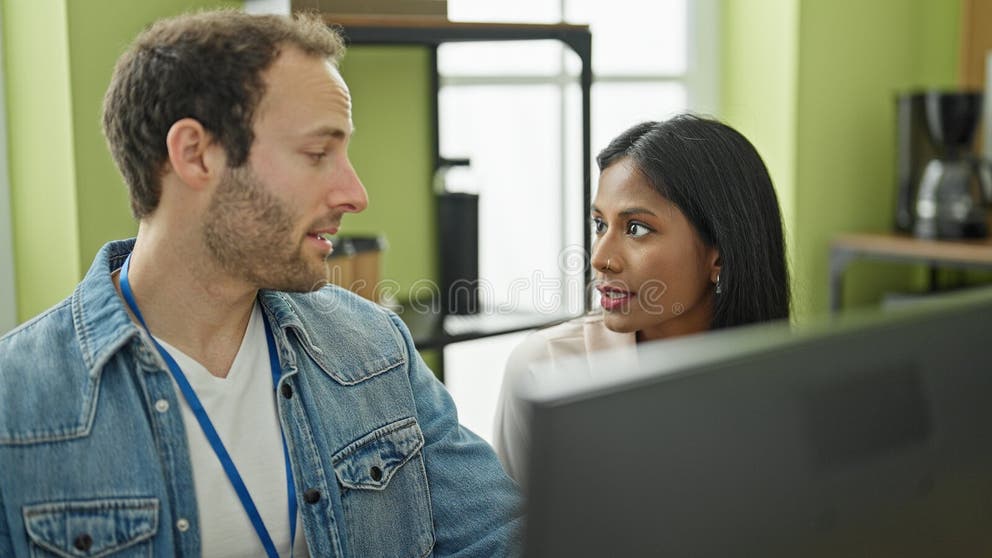 Two Workers Man and Woman Using Computer Speaking at the Office Stock ...