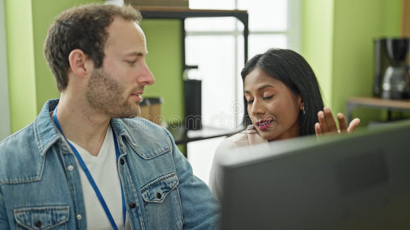 Two Workers Man and Woman Using Computer Speaking at the Office Stock ...