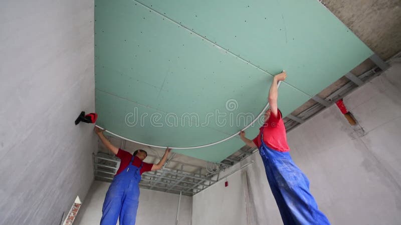 Two Workers are Mounted Ceiling in New Apartment Stock Footage - Video ...