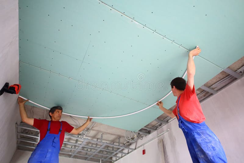 Two Workers are Mounted Ceiling in the New Stock Image - Image of ...