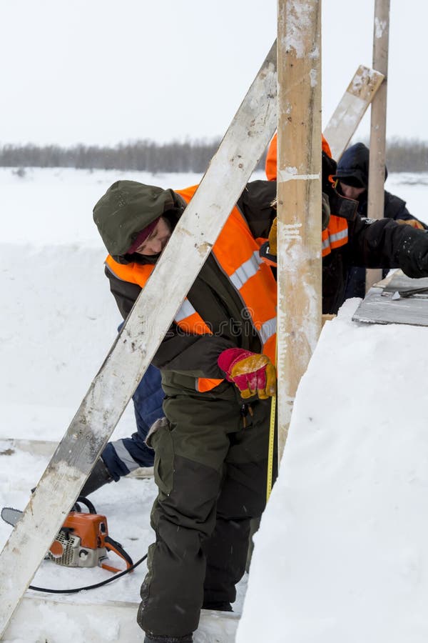 Two Workers in Overalls at a Construction Site Stock Image - Image of ...
