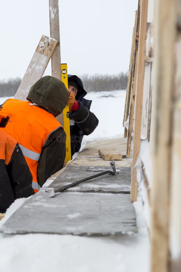 Two Workers in Overalls at a Construction Site Stock Image - Image of ...